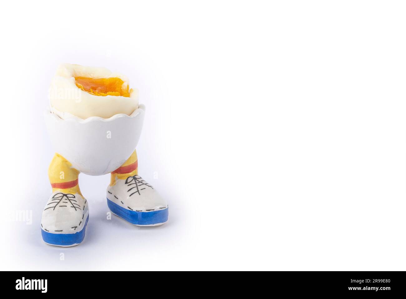 boiled egg open half in stand in the form of legs isolate Stock Photo ...