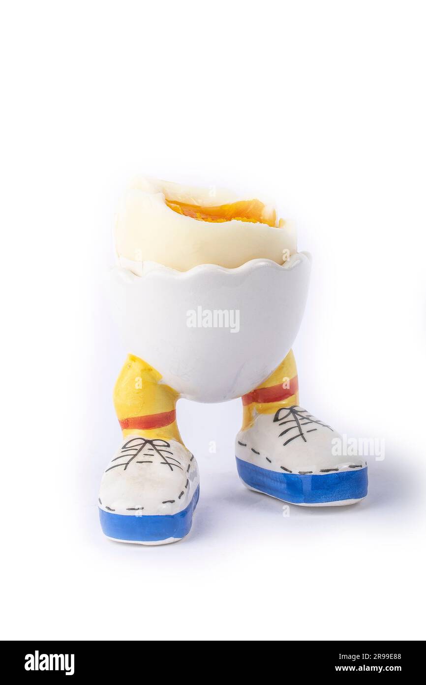 boiled egg open half in stand in the form of legs isolate Stock Photo ...