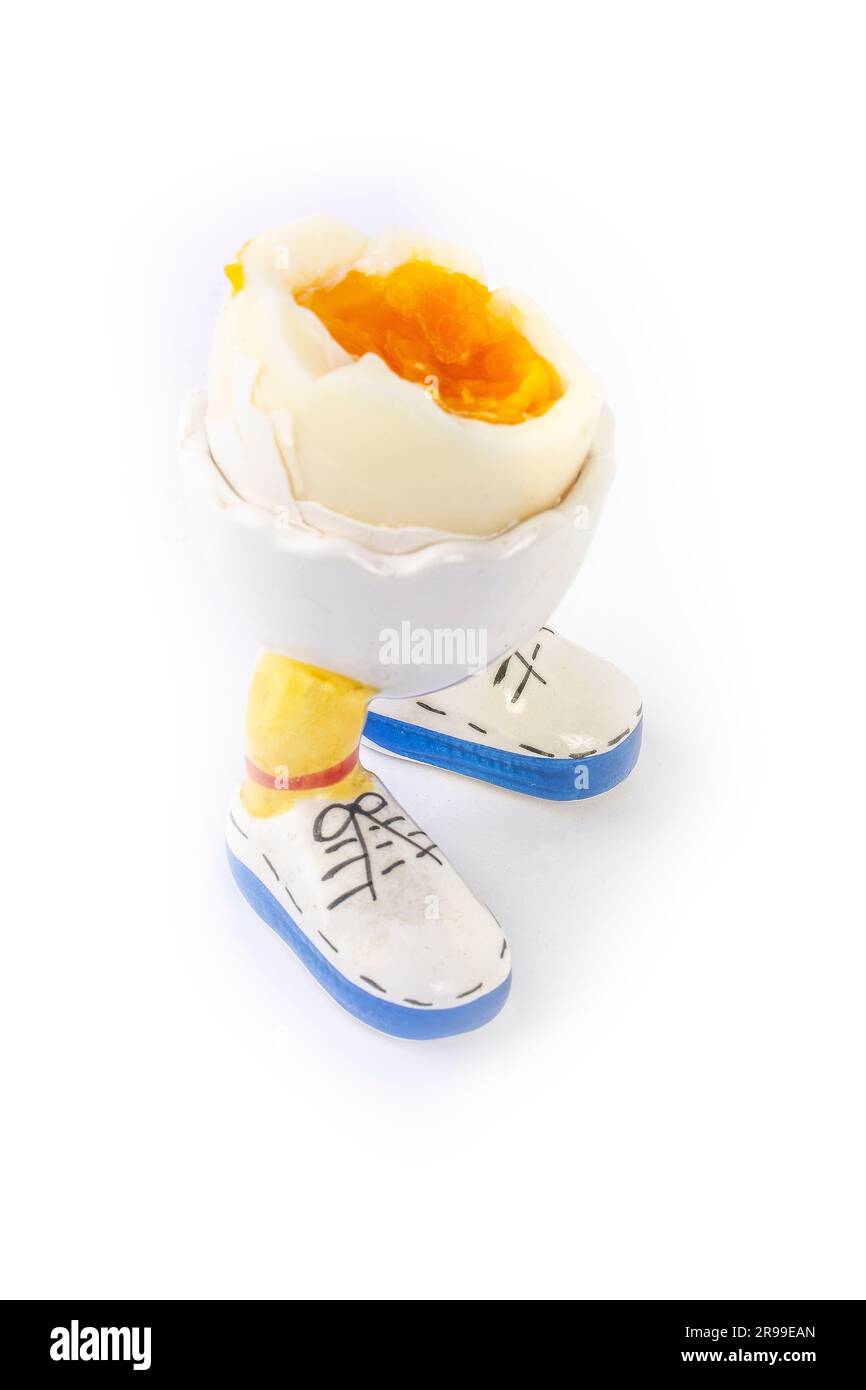 boiled egg open half in stand in the form of legs isolate Stock Photo ...