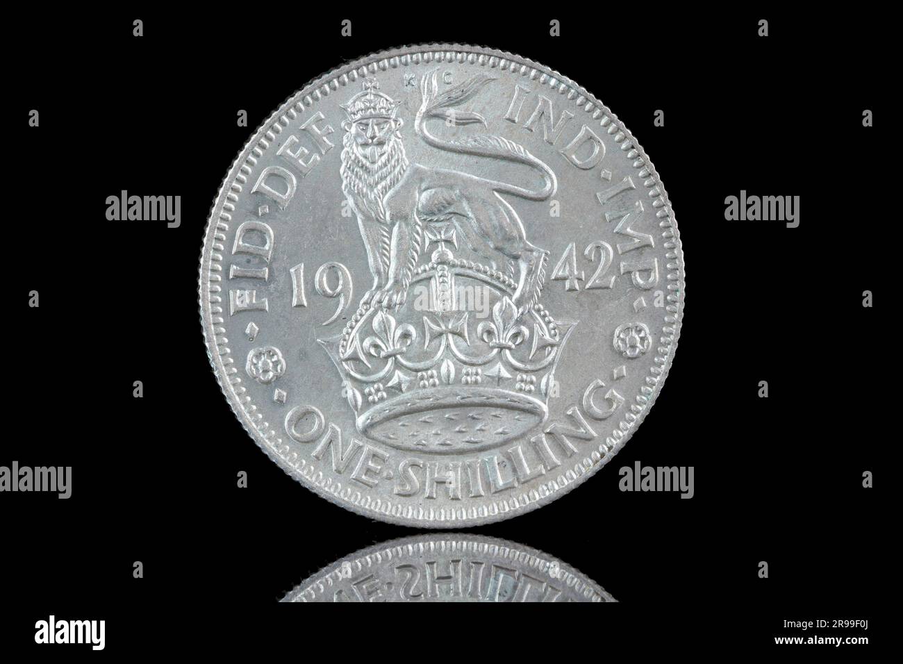 Reverse of a UK 1942 one shilling coin featuring a Lion stood on the ...