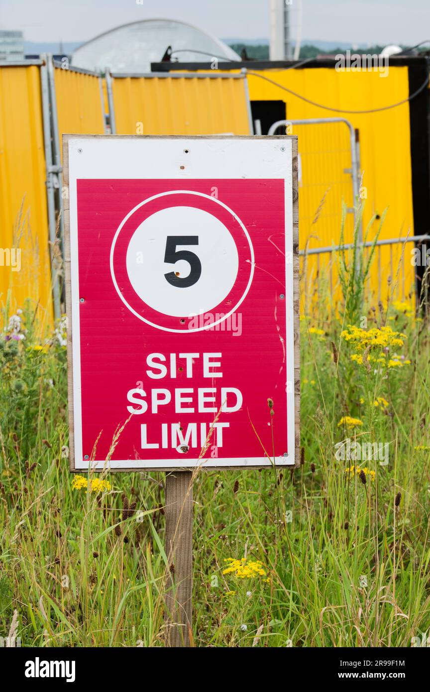 Construction site speed limit sign on fence boundary Stock Photo - Alamy