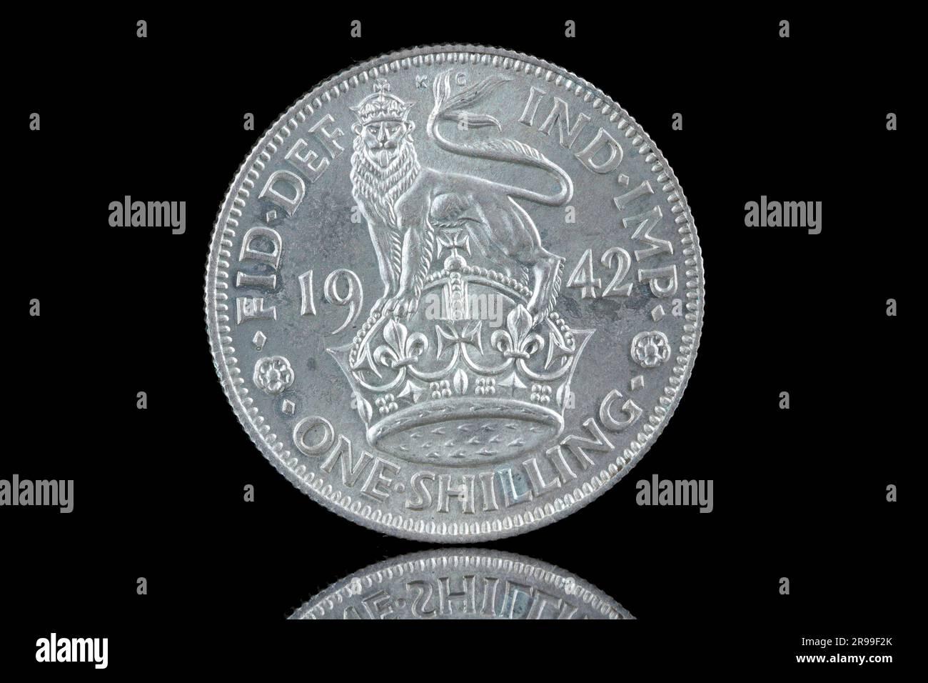 Reverse of a UK 1942 one shilling coin featuring a Lion stood on the ...