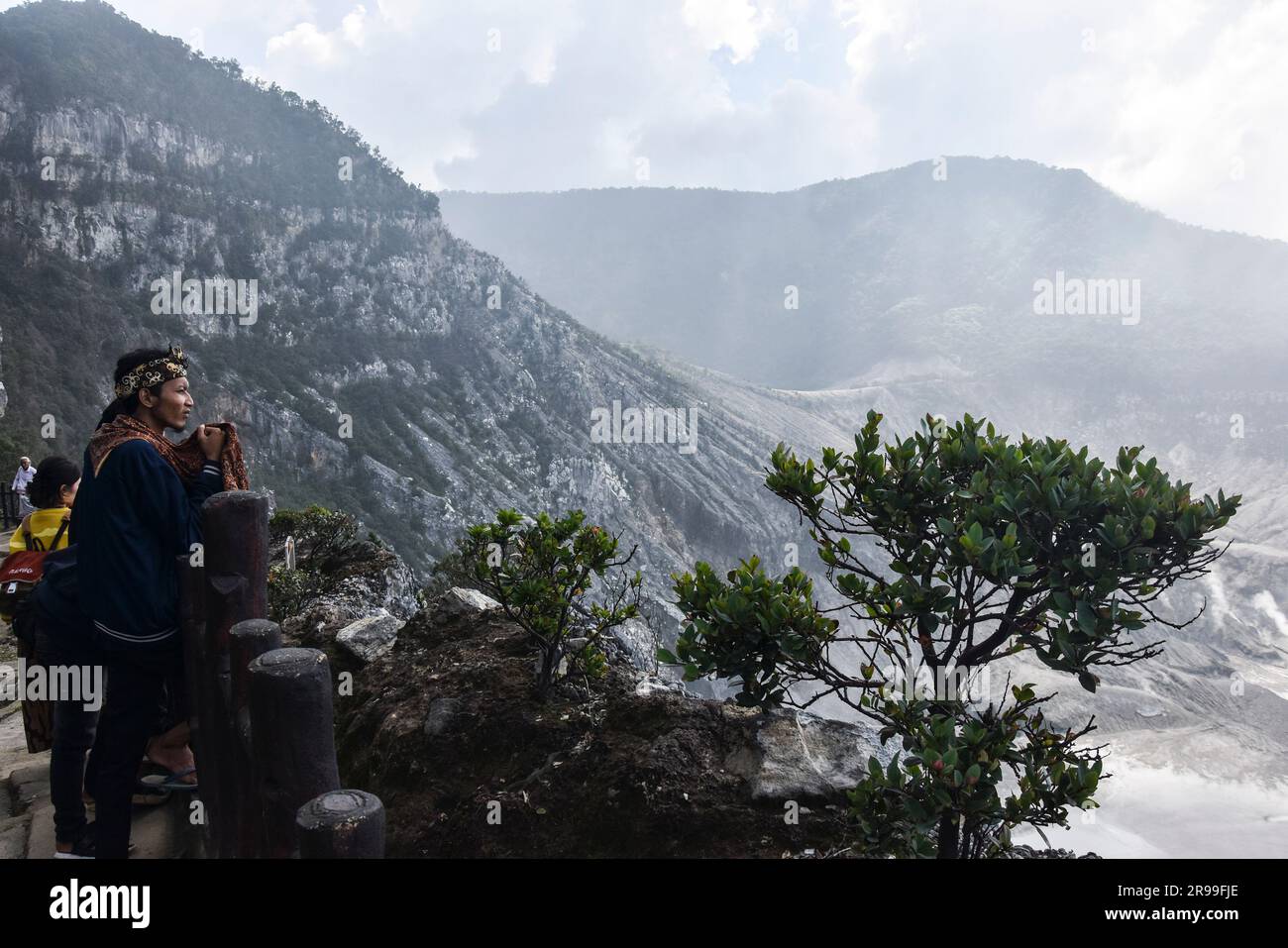 Bandung, Indonesia. 25th June, 2023. A tourist looks at the crater of ...