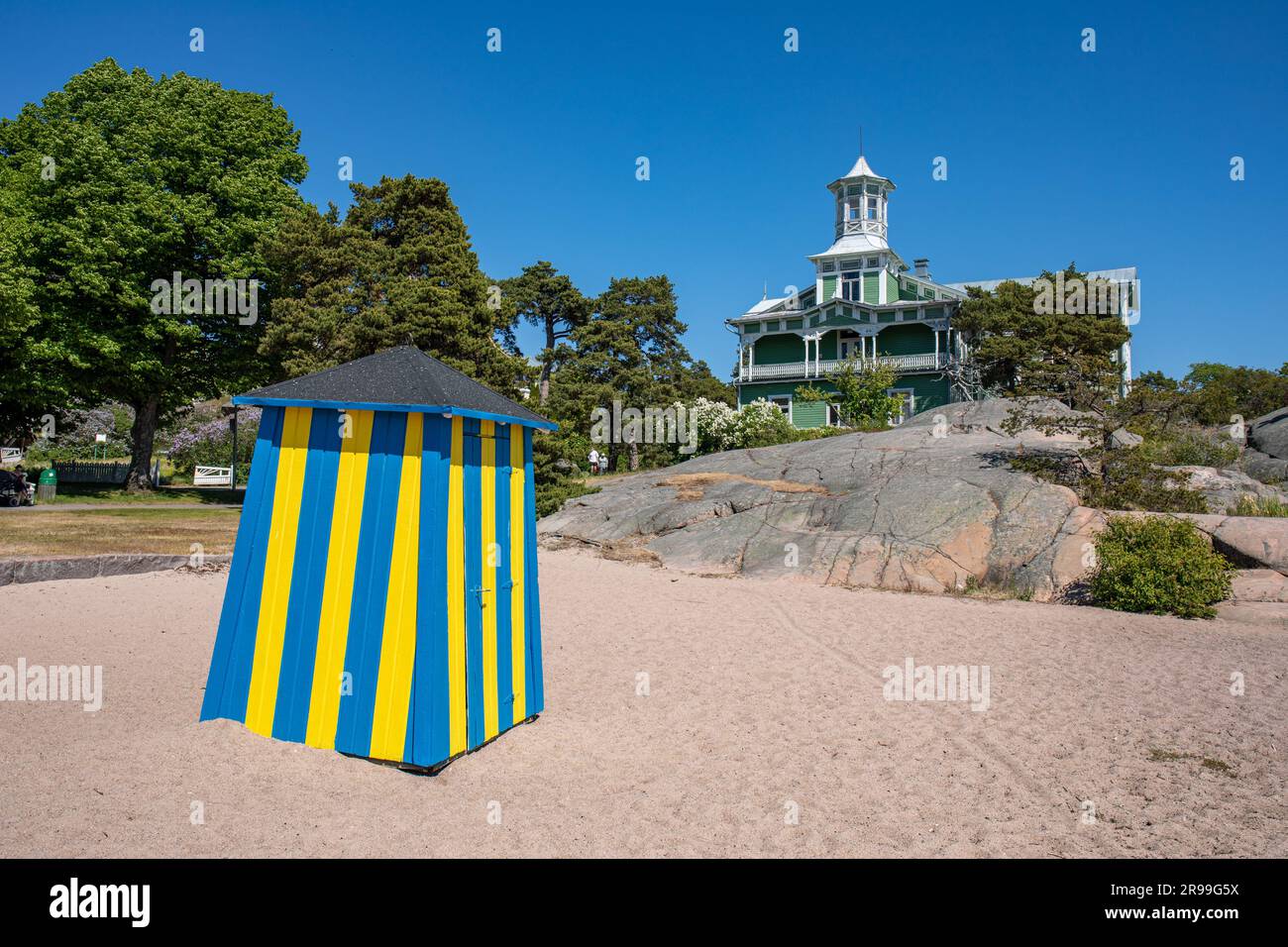 Colorful beach changing cabin and Villa Tellina boardinghouse on a ...