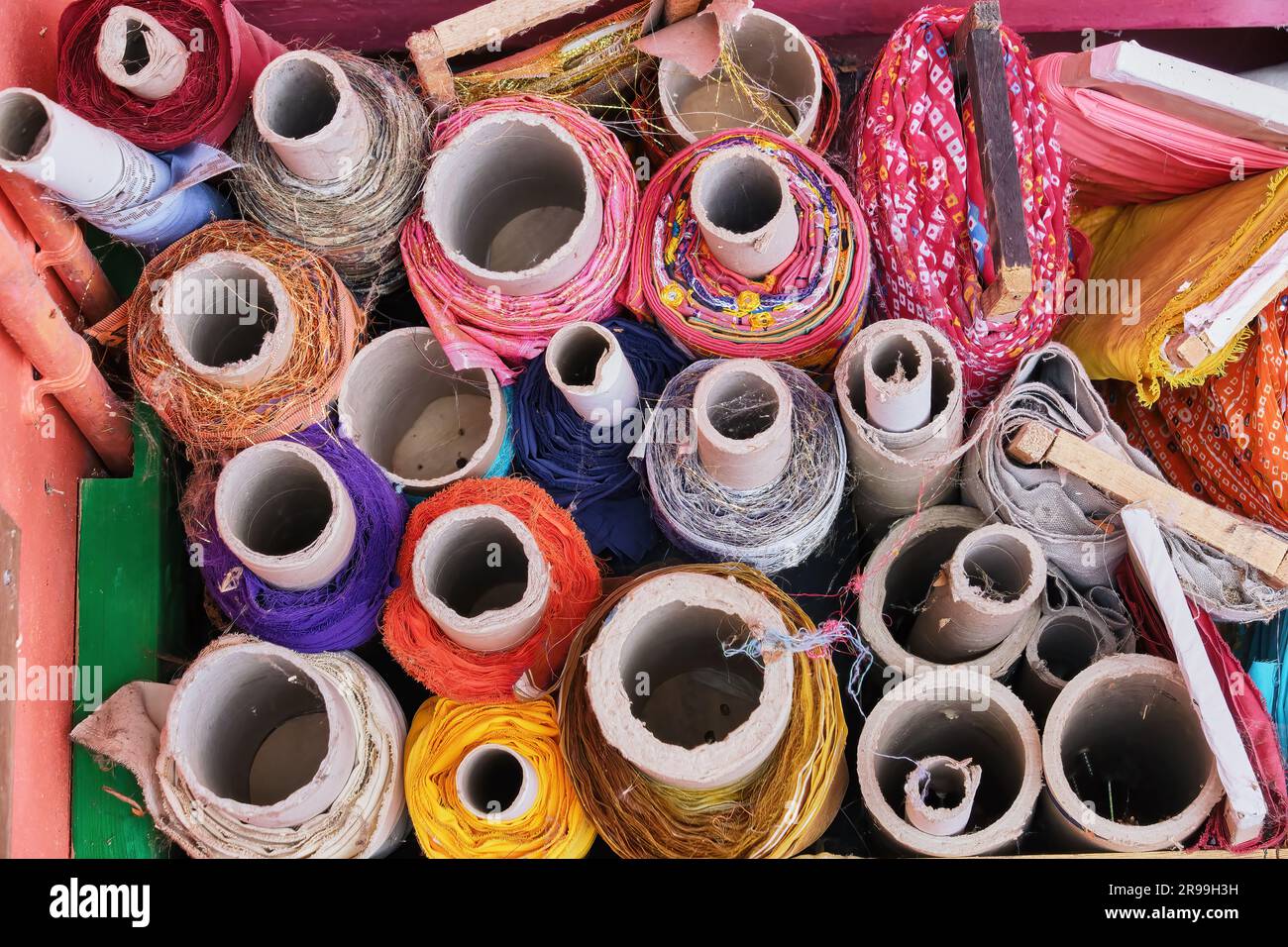 Rolls of different colours and patterned Indian saree dress textiles ...