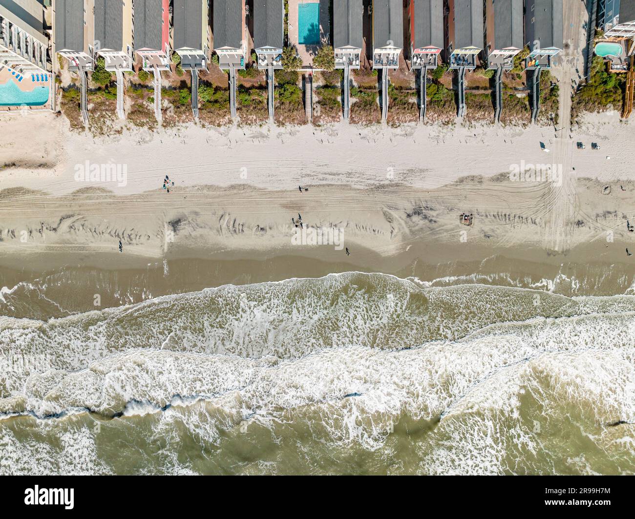 An aerial view of stunning view of beachfront condos situated along an ...
