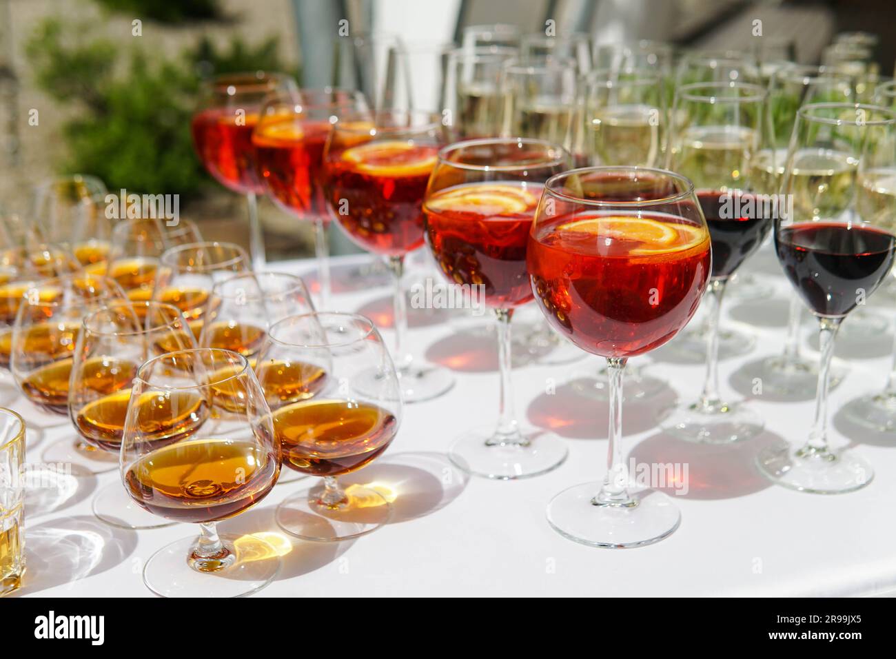 Set of alcoholic cocktails in glasses on the white banquet table Stock ...