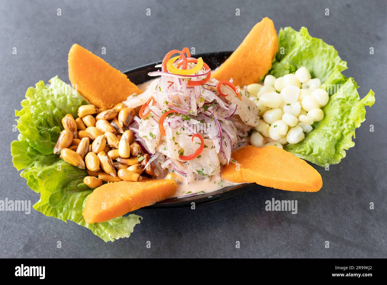 Peruvian ceviche, Fish marinated in lime, ginger, coriander and garnish ...