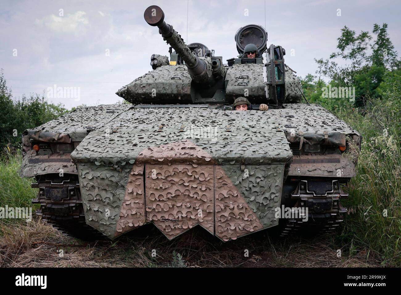 Ukrainian soldiers on a Swedish CV90 infantry fighting vehicle at their ...