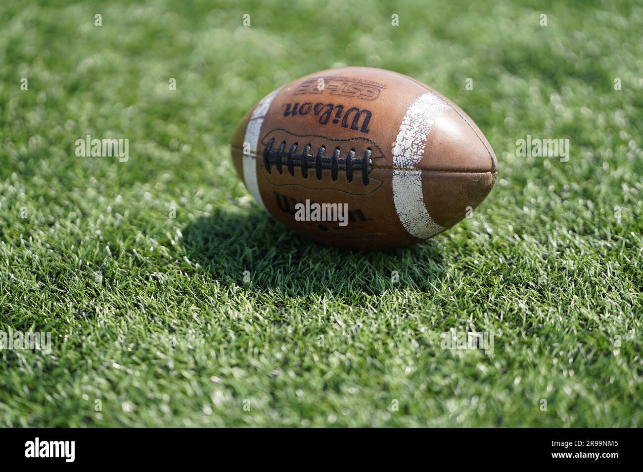 Wilson American Football on an artificial turf Stock Photo - Alamy