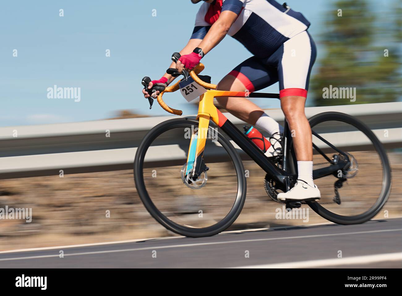 Motion blur of a bike race with the bicycle and rider at high speed ...