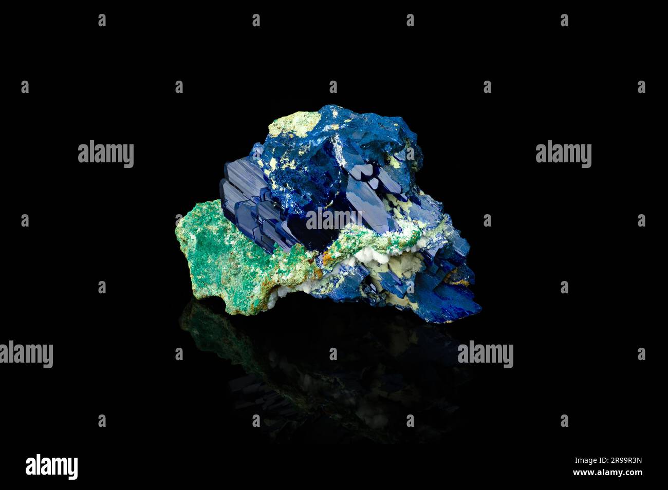 blue azurite on gren malachite isolated on black background. macro ...