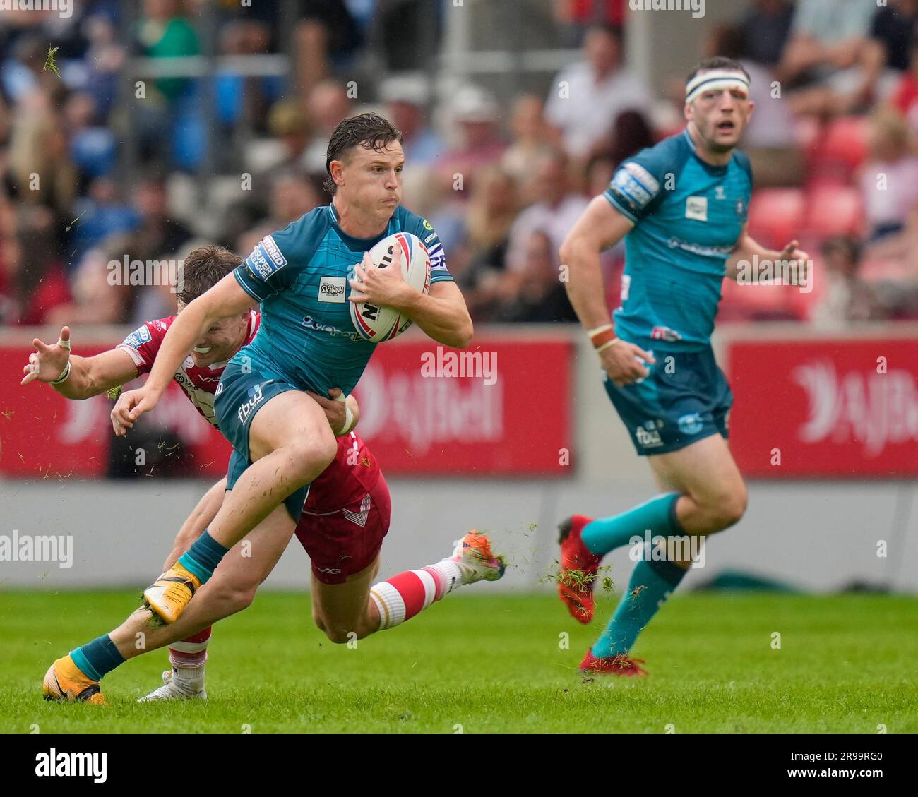 Jai Field #1 of Wigan Warriors makes a break during the Betfred Super ...