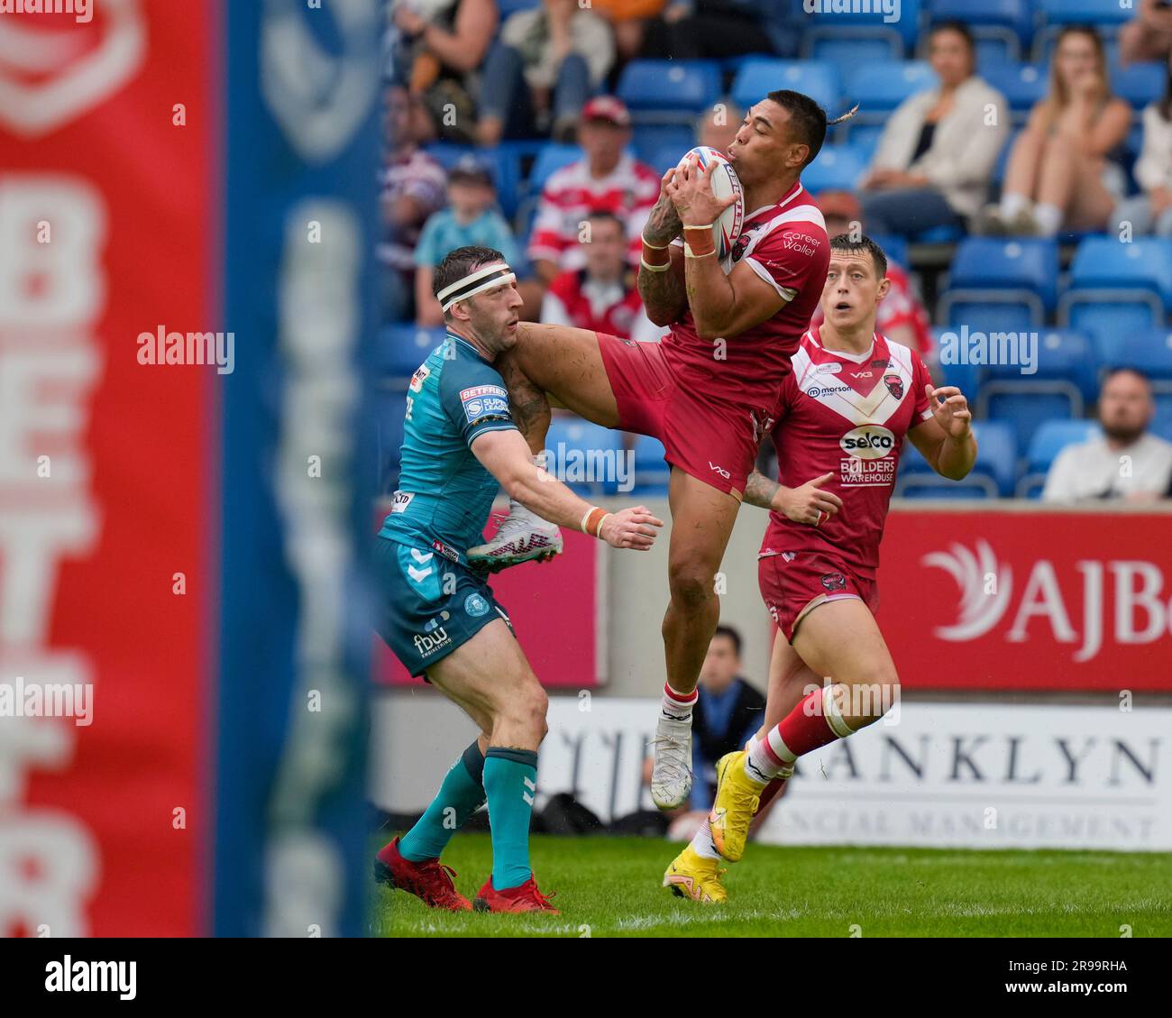 Eccles, UK. 25th June, 2023. Ken Sio #2 of Salford Red Devils catches a high ball under pressure ...