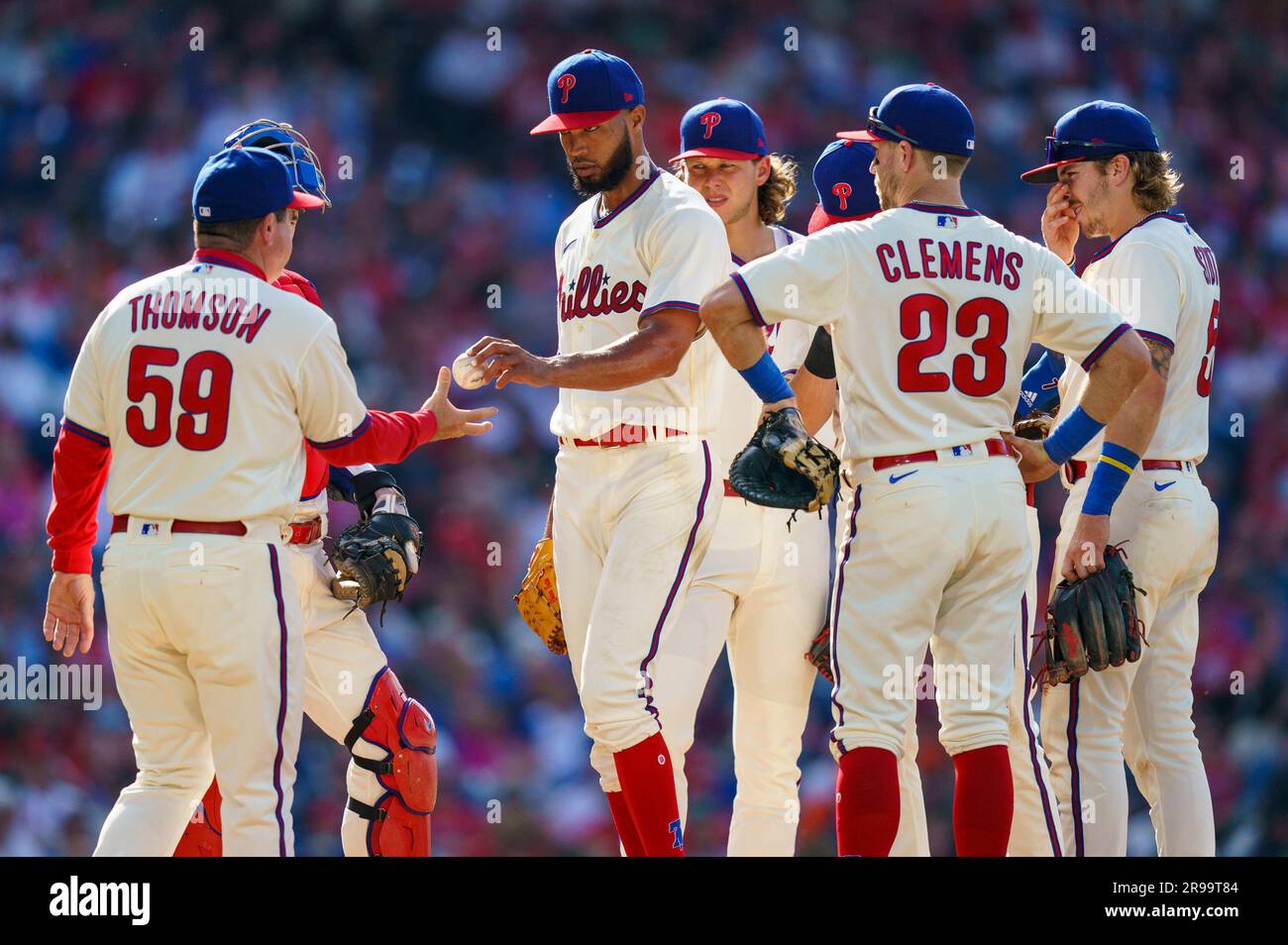 Philadelphia Phillies' Cristopher Sanchez, third from left, hands the ...