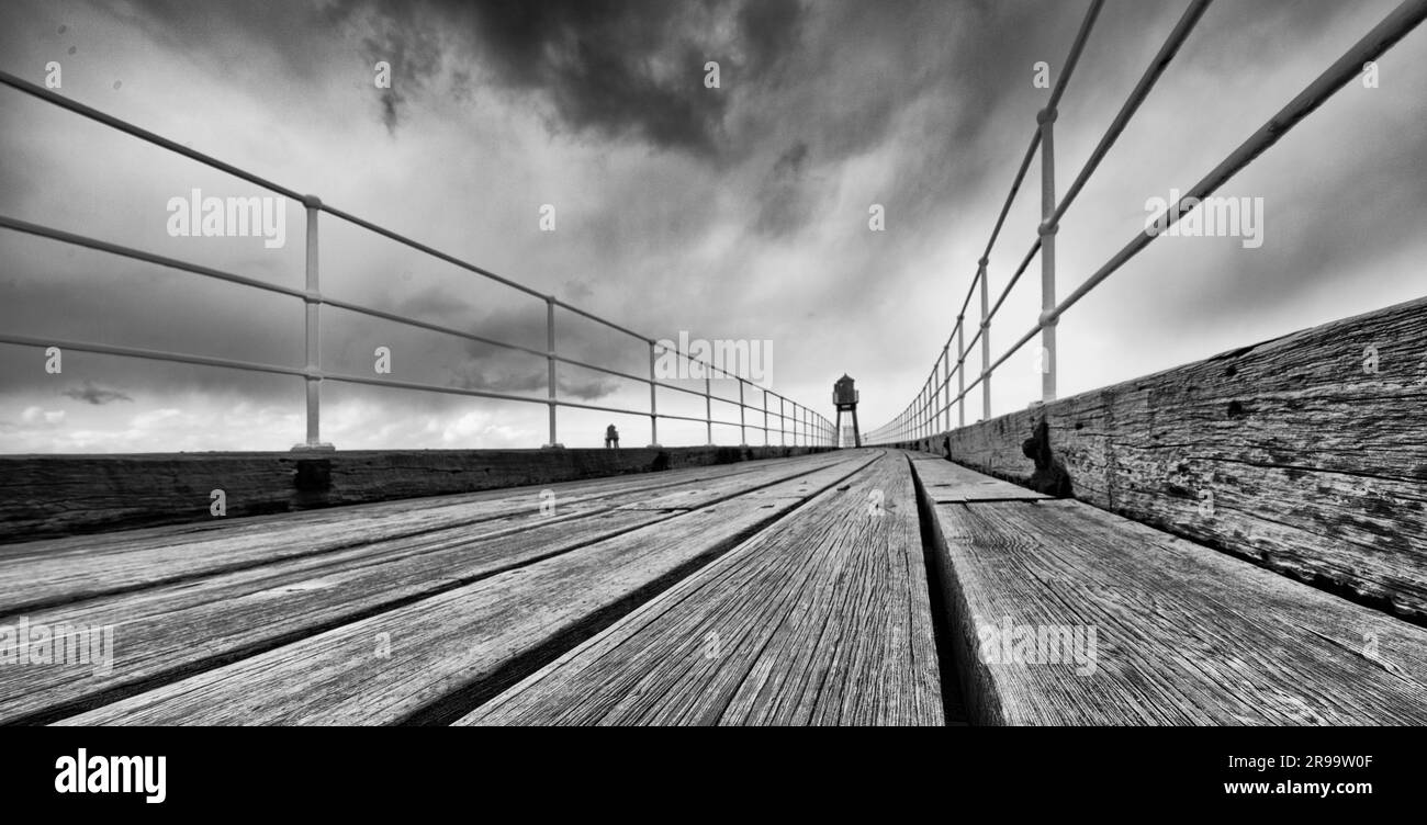 Low level view of wooden pier at Whitby Stock Photo - Alamy