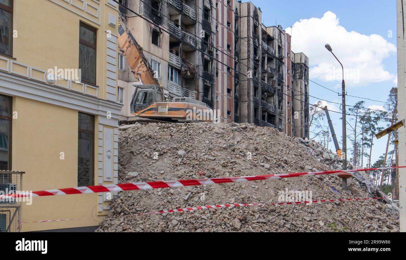 Construction work on the demolition of multi-storey apartments. Fence ...