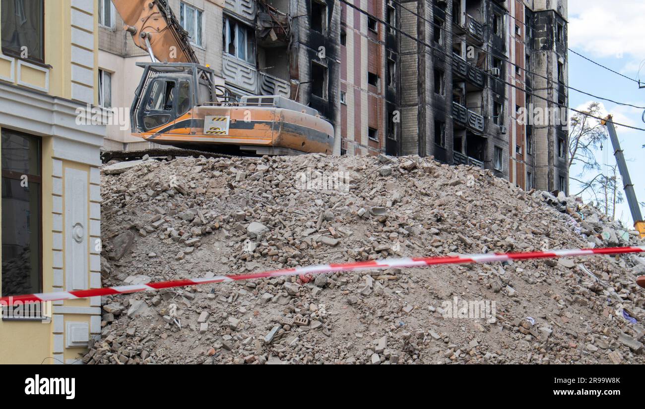 Construction work on the demolition of multi-storey apartments. Fence ...