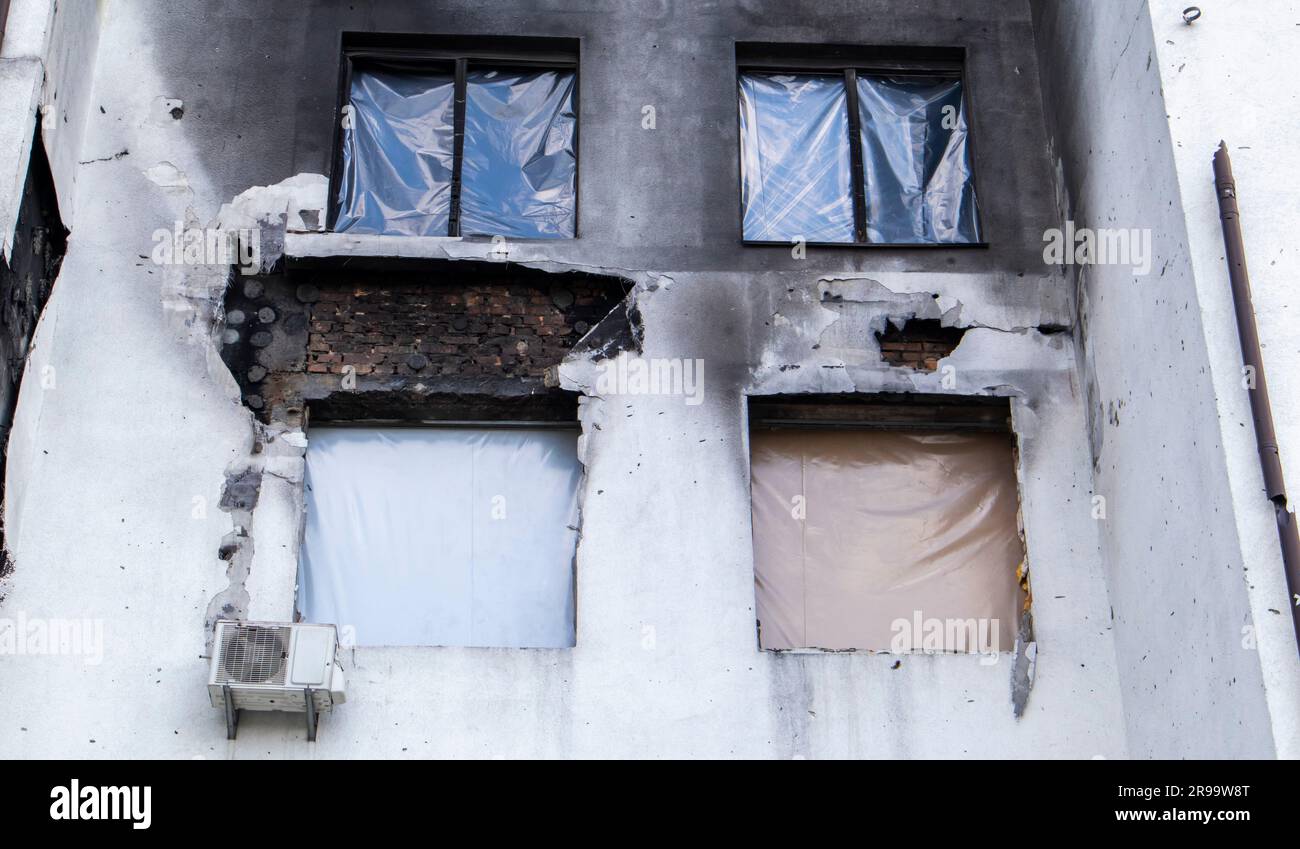Residential buildings, windows and balconies were damaged by the blast ...