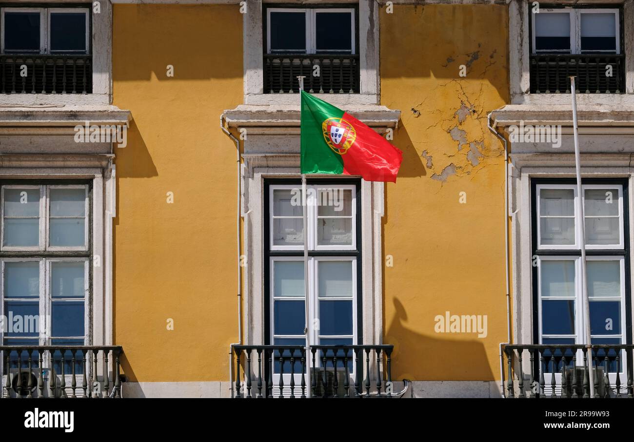 Portuguese flag waving in the wind in Lisbon Stock Photo - Alamy