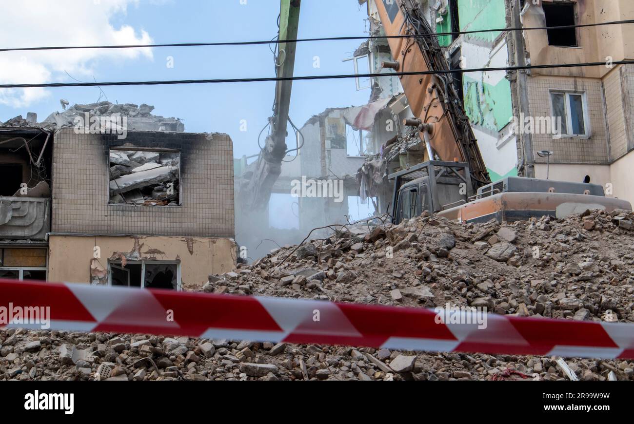 Construction work on the demolition of multi-storey apartments. Fence ...