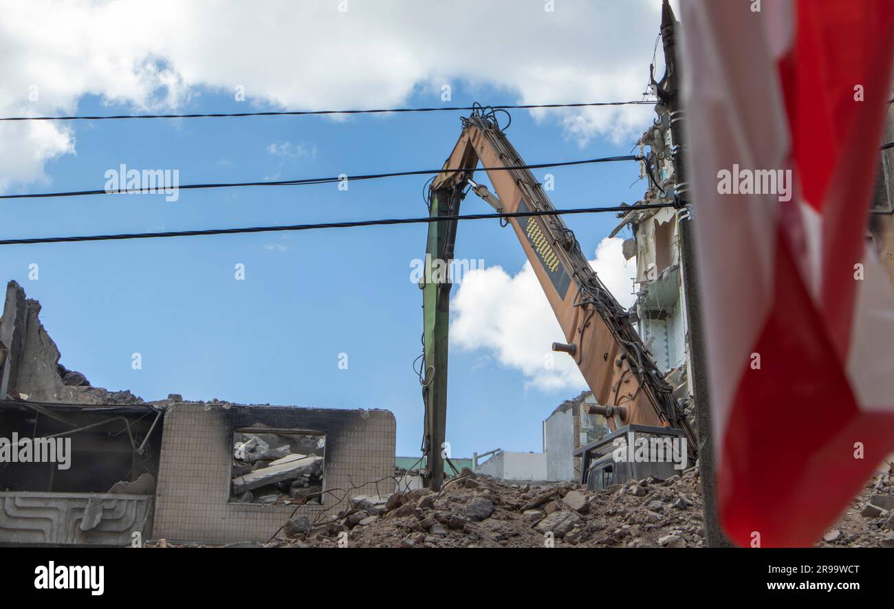 Construction work on the demolition of multi-storey apartments. Fence ...