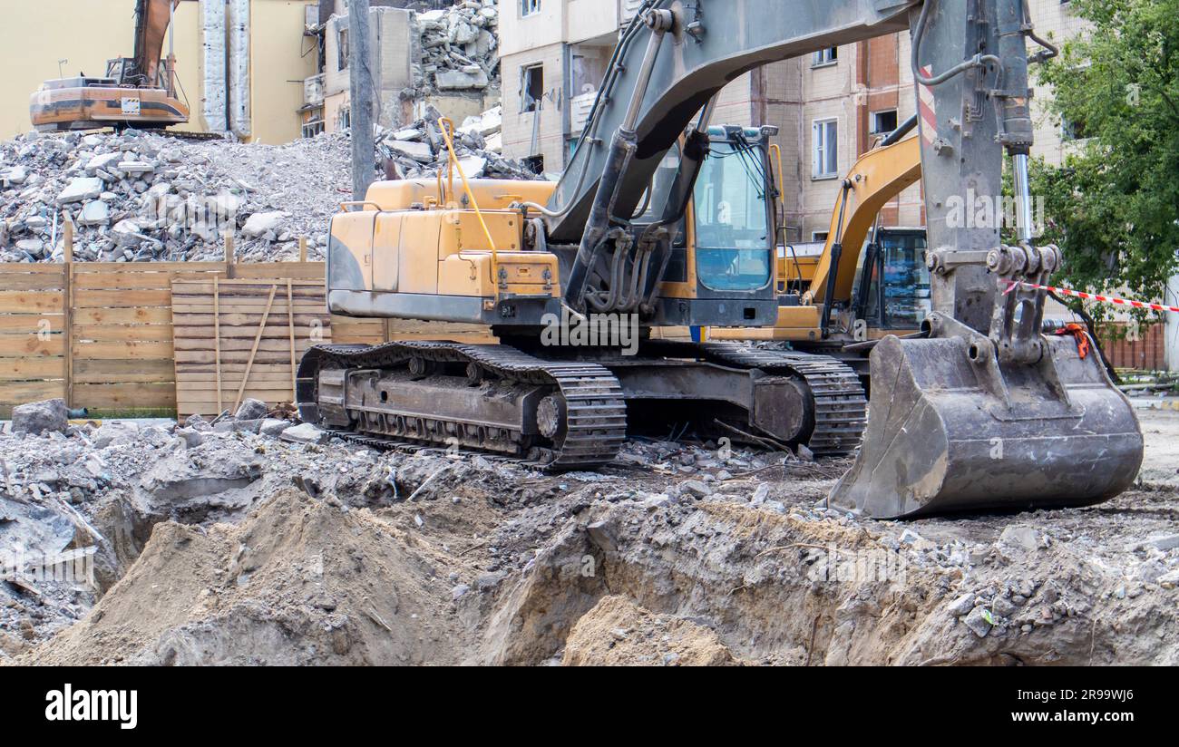 Construction work on the demolition of multi-storey apartments. Fence ...