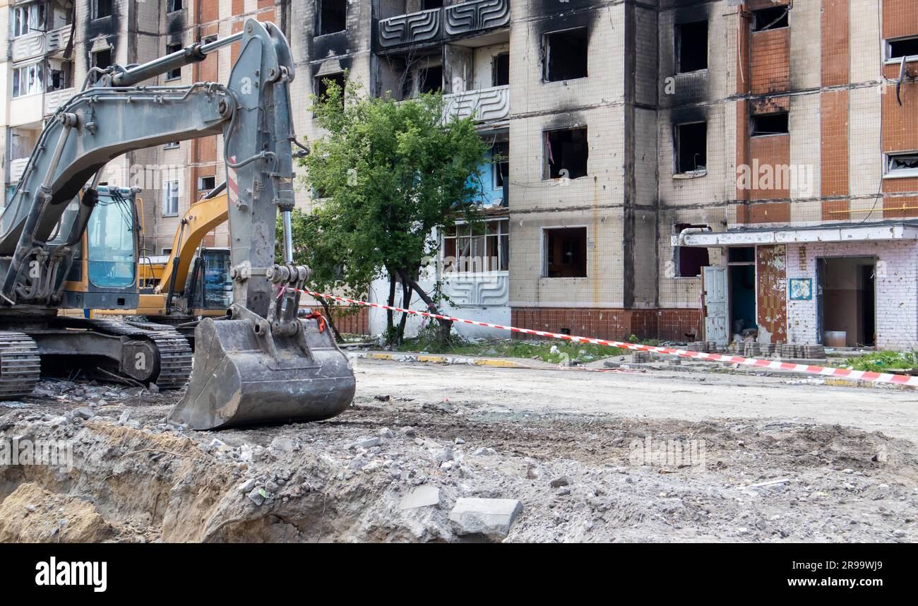 Construction work on the demolition of multi-storey apartments. Fence ...