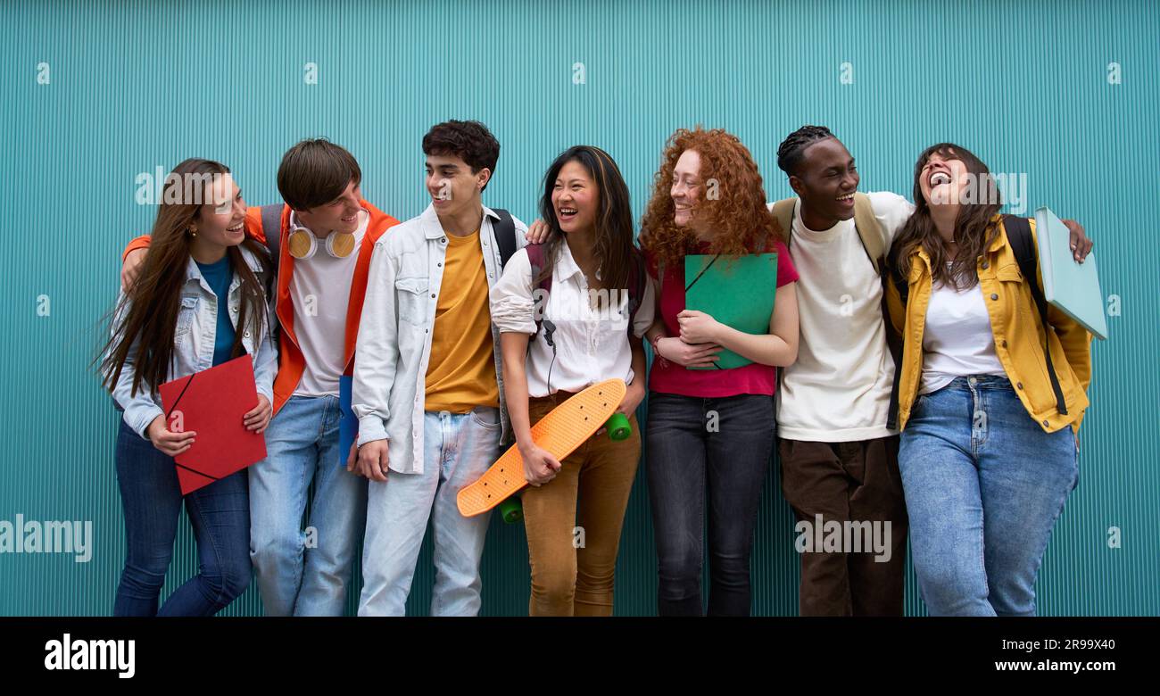 Group of smiling multi-ethnic university students enjoying break from ...