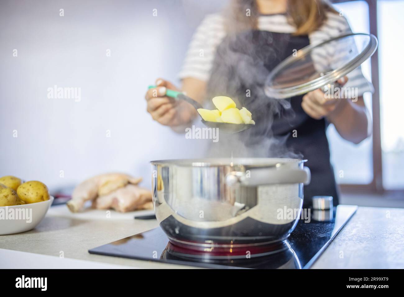 Young woman is cooking in the kitchen. Healthy eating. Healthy ...