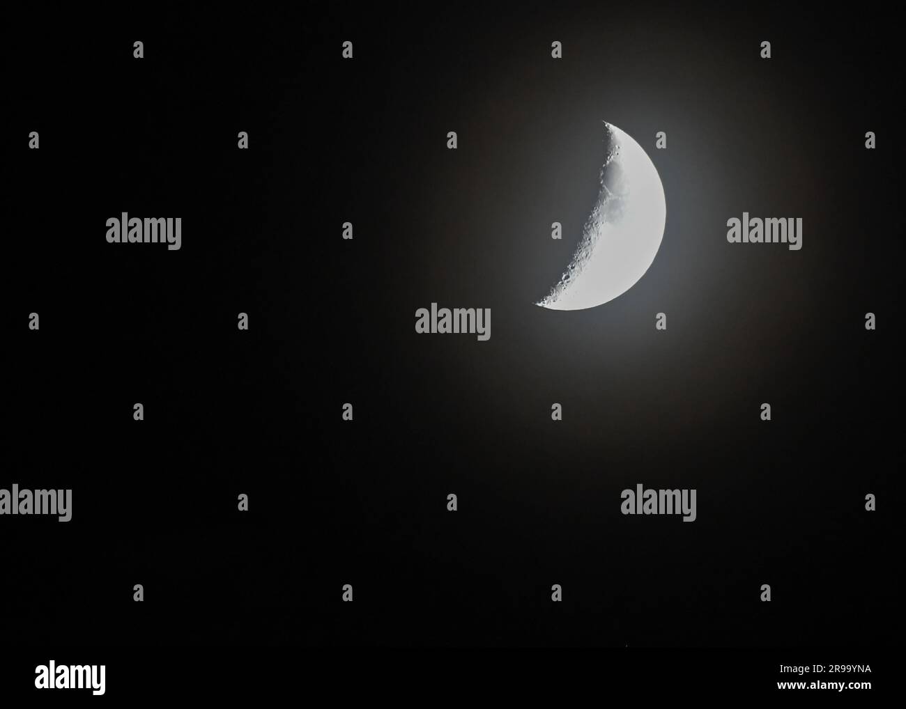 glowing Half moon lit up at night with black sky Stock Photo - Alamy