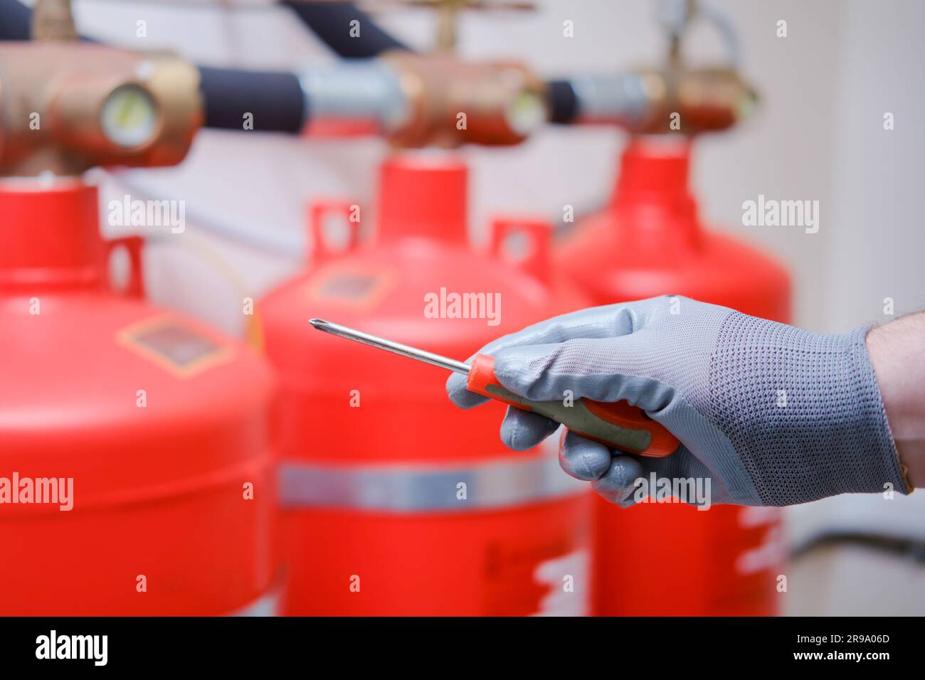 The inspector is checking the automatic fire protection equipment to ...