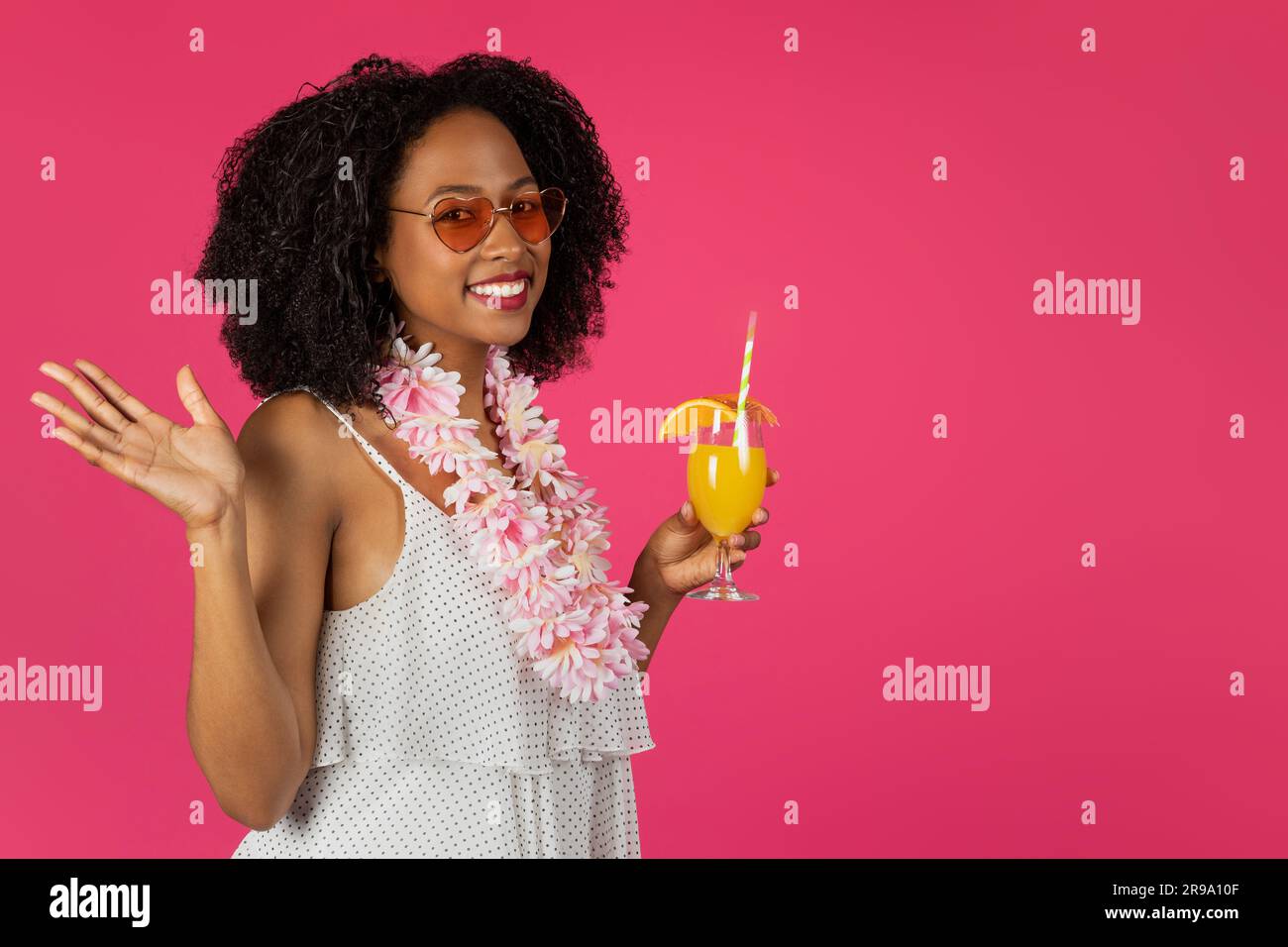 Smiling millennial black woman student in glasses waving hand, drinking ...