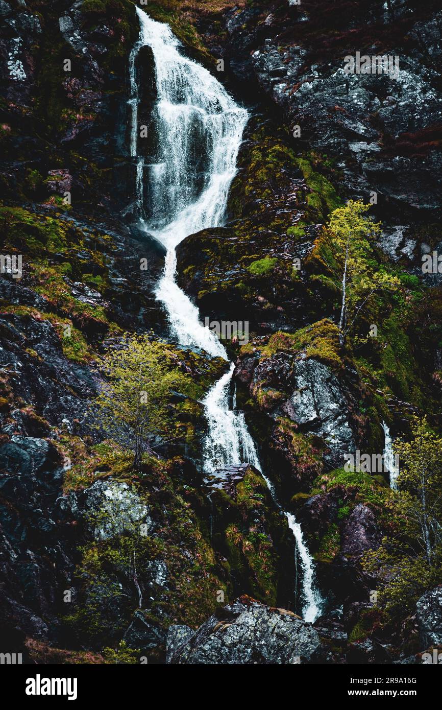 A scenic waterfall cascades down a rocky mountain side, Corrie Fee ...