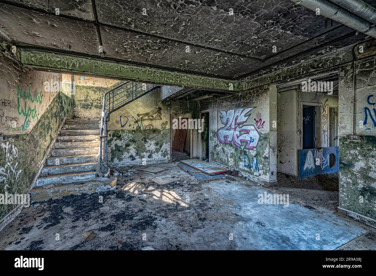 View of hall and stairs in living quarters of old abandoned RAF airbase ...