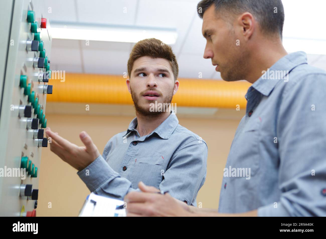 Construction workers operating heavy hi-res stock photography and ...