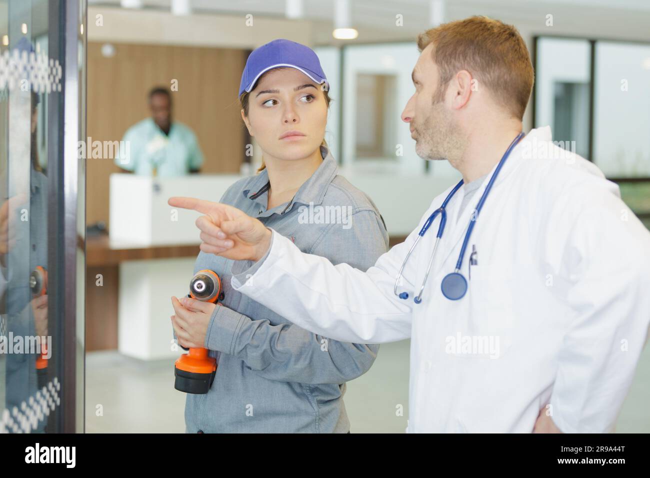 Female janitor school hi-res stock photography and images - Alamy