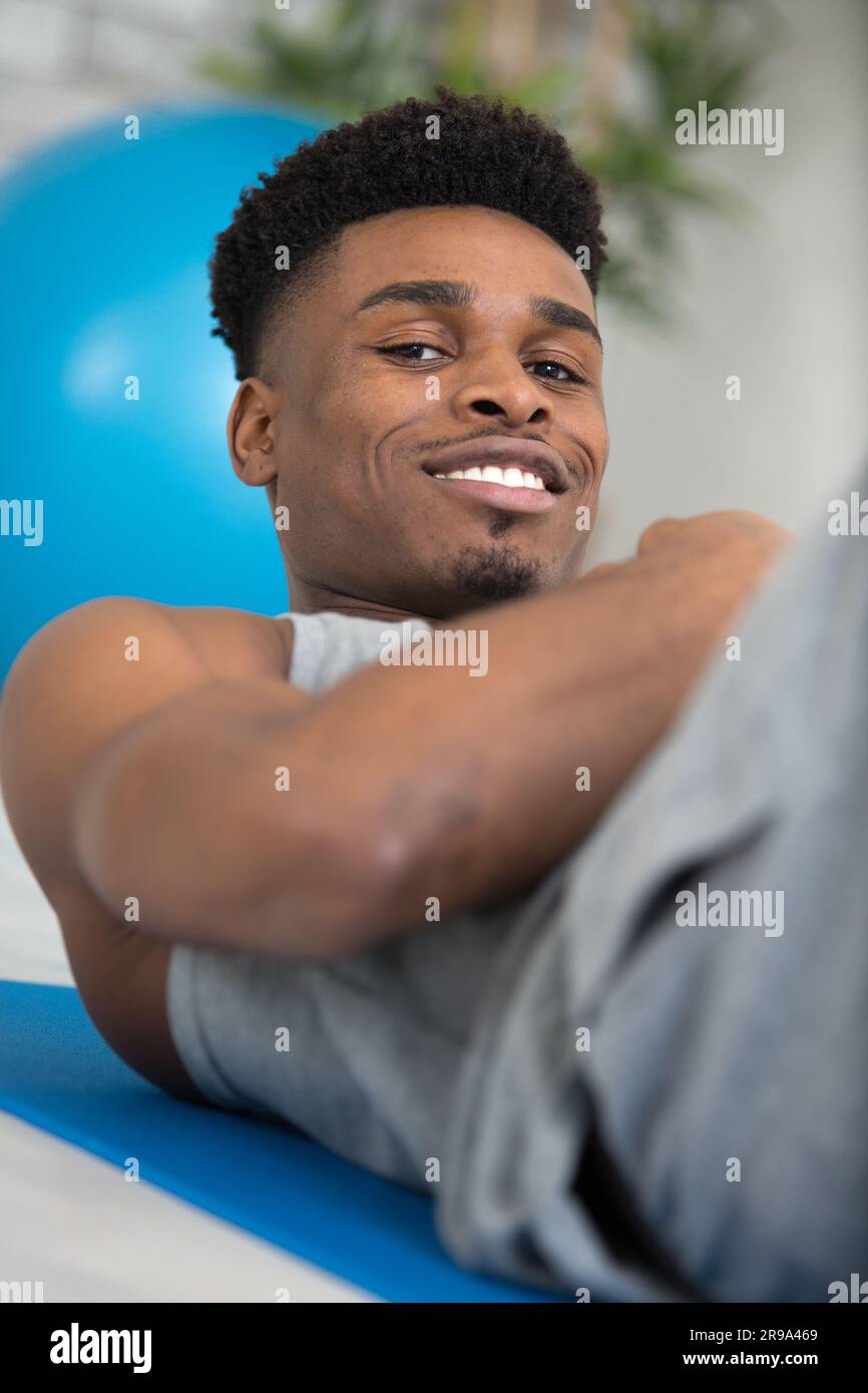 Muscular man lying on floor hi-res stock photography and images - Alamy