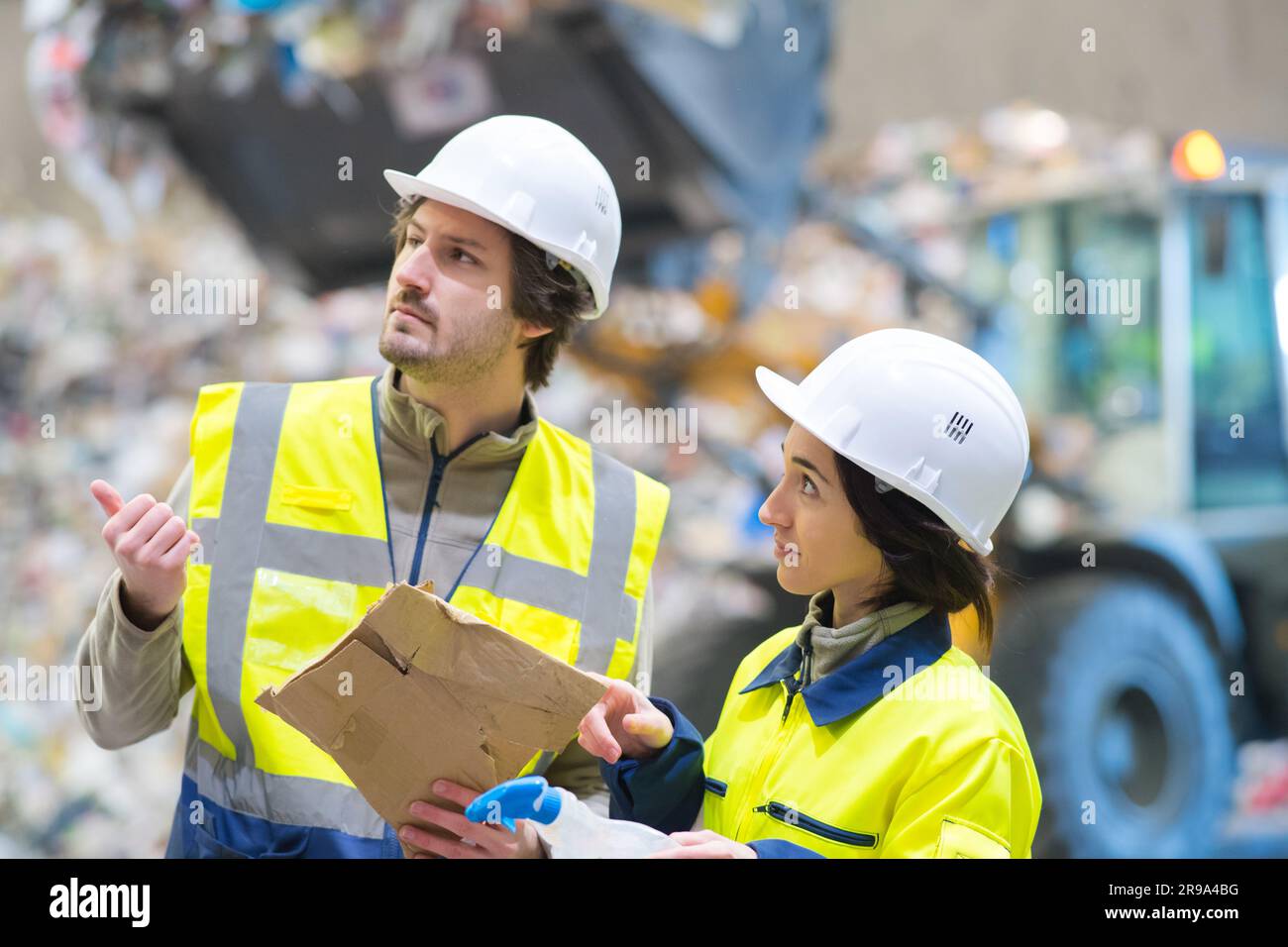 recycling workers researching on the landfill Stock Photo - Alamy