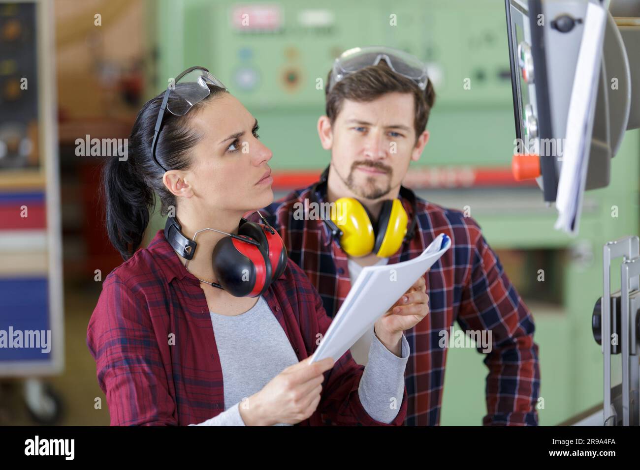 cnc machine operators talking in factory Stock Photo - Alamy