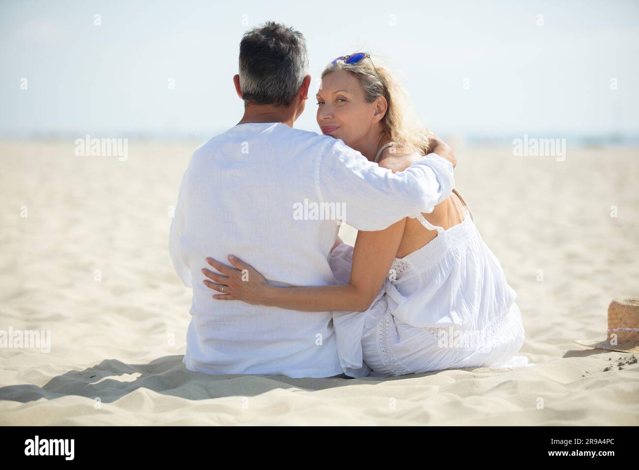 couple hugging on the beach in summer Stock Photo - Alamy