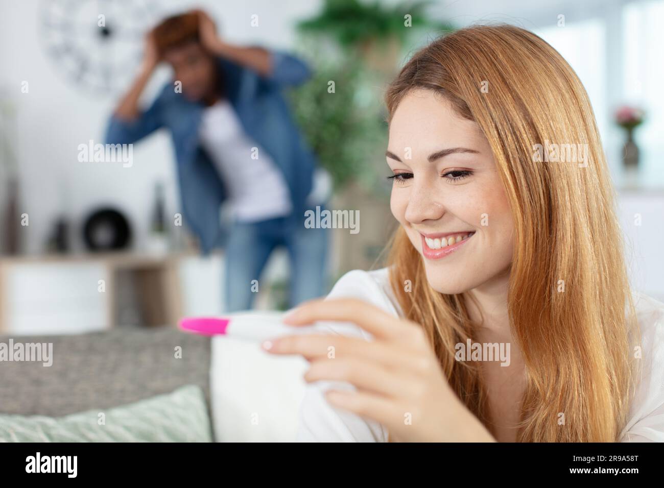 not ready worried man and happy pregnant girlfriend Stock Photo - Alamy