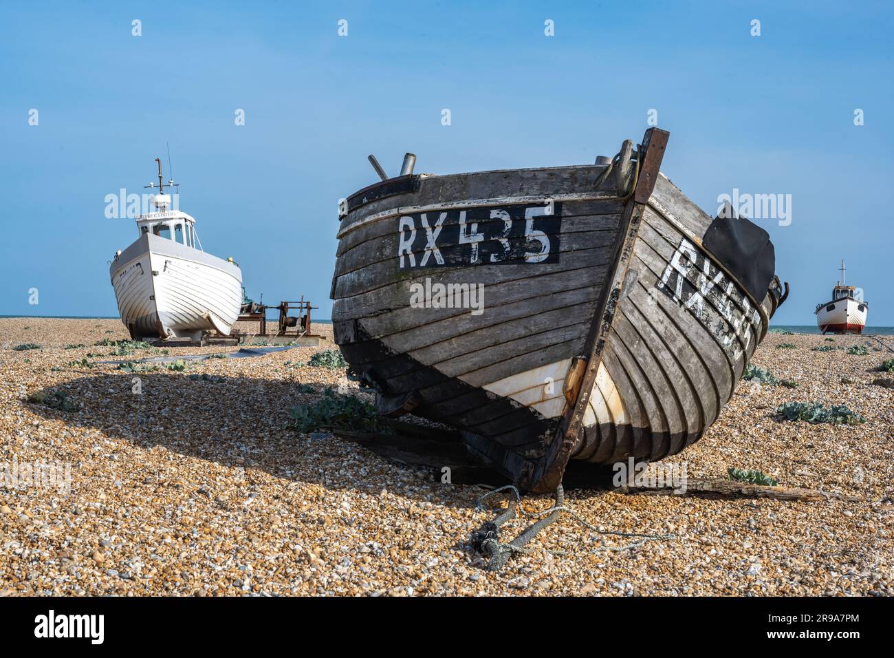 Beached wooden fishing boat on Kent shore Stock Photo - Alamy