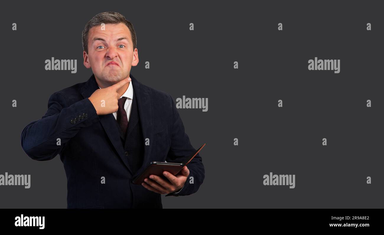 Angry boss with a gadget makes a hand gesture Stock Photo - Alamy