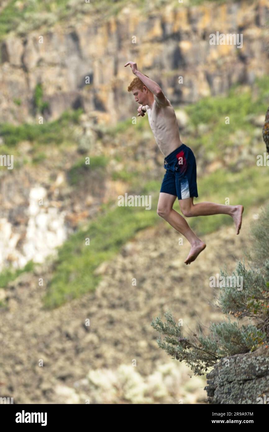 Person Jumping Off Cliff