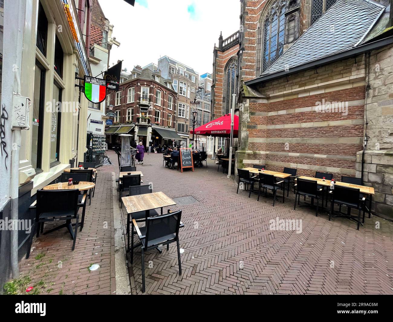 Amsterdam, the Netherlands - October 10, 2021: People eating, drinking ...