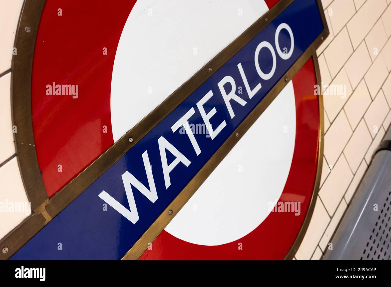 Waterloo Underground Station sign and logo on the wall next to platform ...