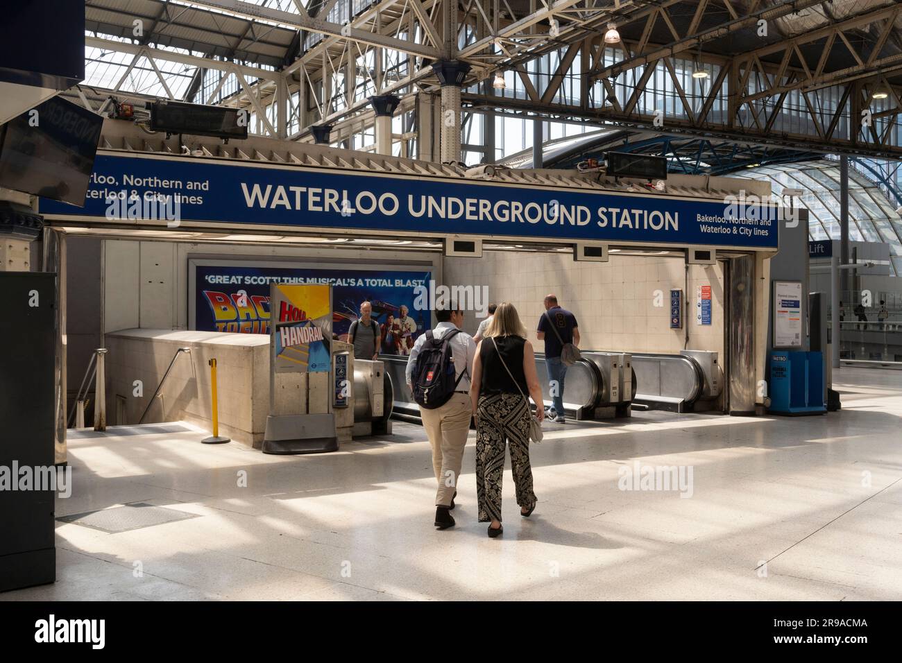 People walking in and out of the entrance to Waterloo Underground tube ...