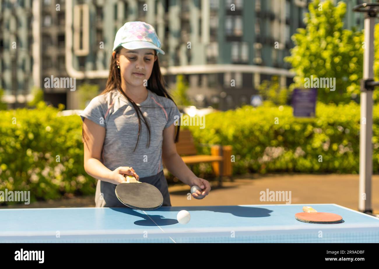Cute girl playing table tennis hi-res stock photography and images - Alamy