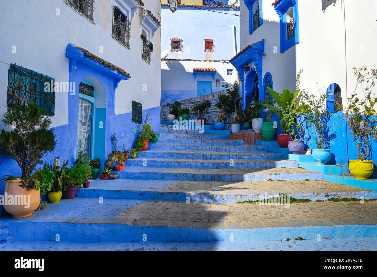 Multi-storied Moroccan style residential buildings in white with blue ...